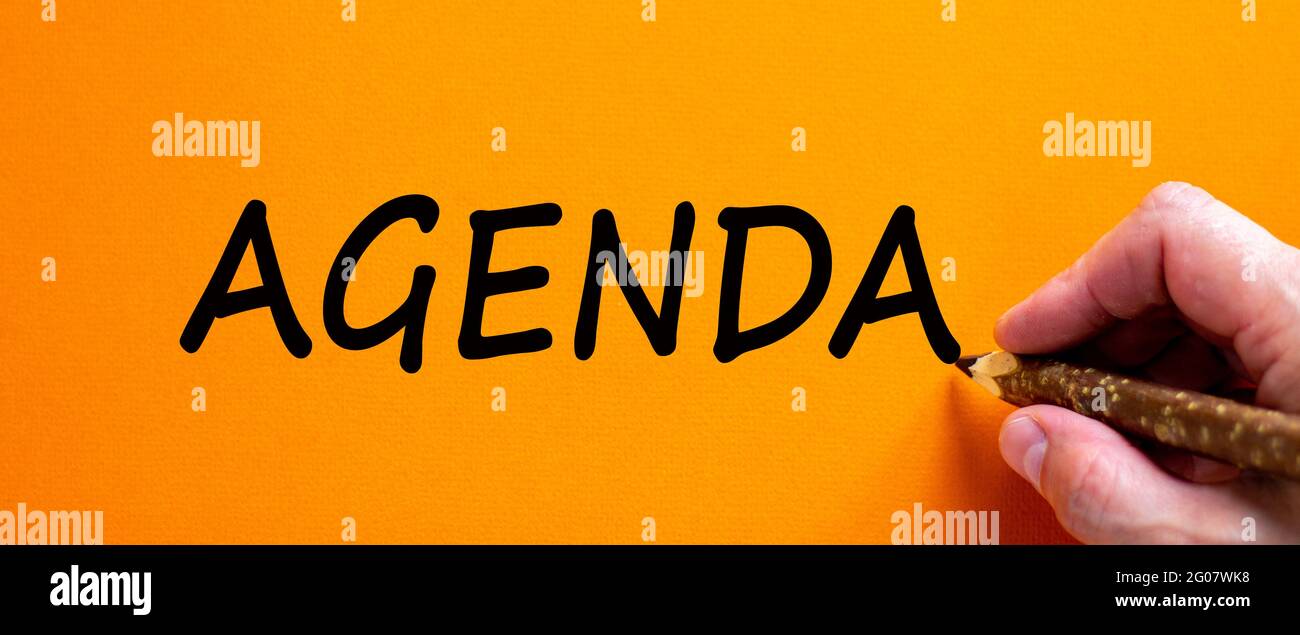 Agenda symbol. Businessman writing the concept word 'agenda', isolated ...