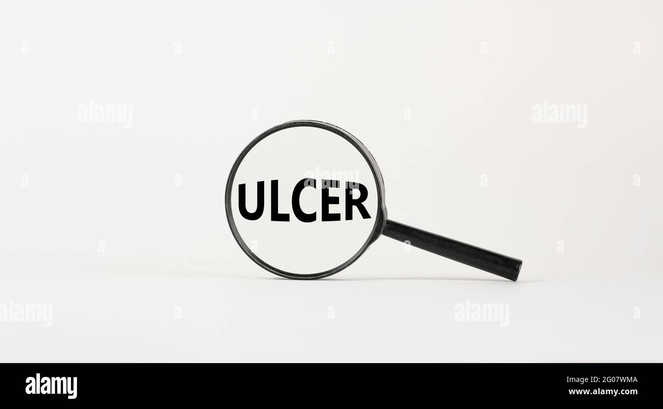 Medical and ulcer symbol. Magnifying glass with the concept word ulcer ...