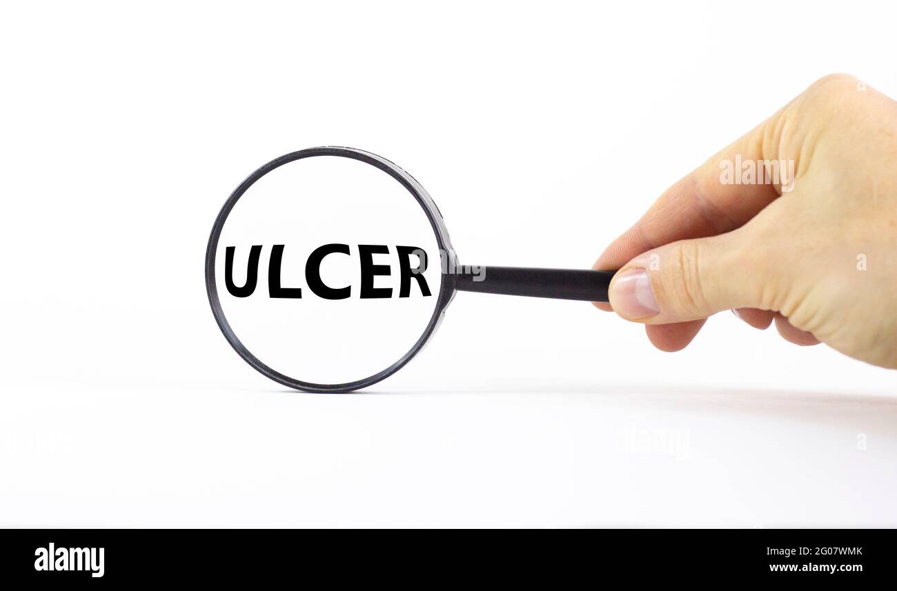 Medical and ulcer symbol. Magnifying glass with the concept word ulcer ...