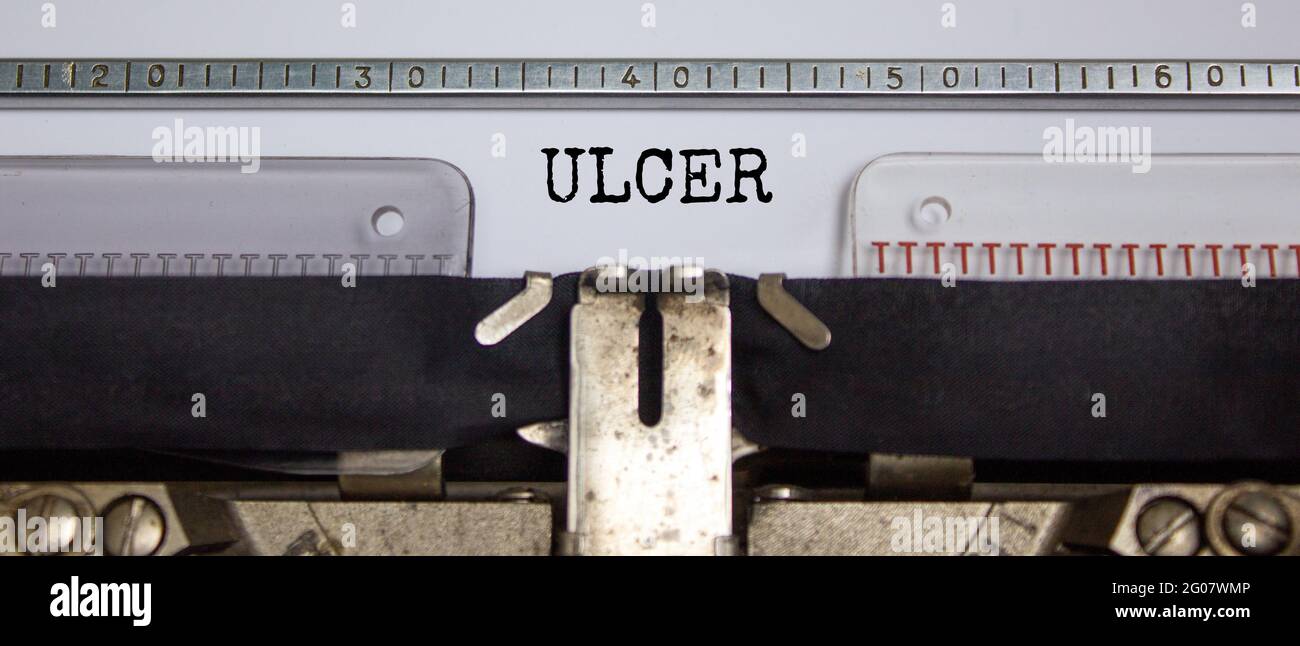 Medical and ulcer symbol. The concept word 'ulcer' typed on retro ...