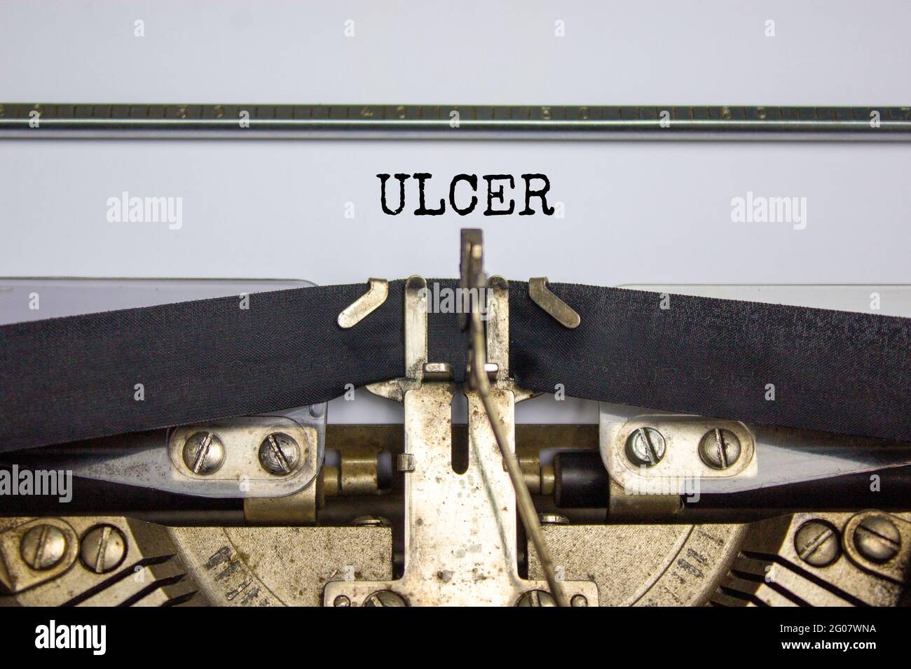 Medical and ulcer symbol. The concept word 'ulcer' typed on retro ...