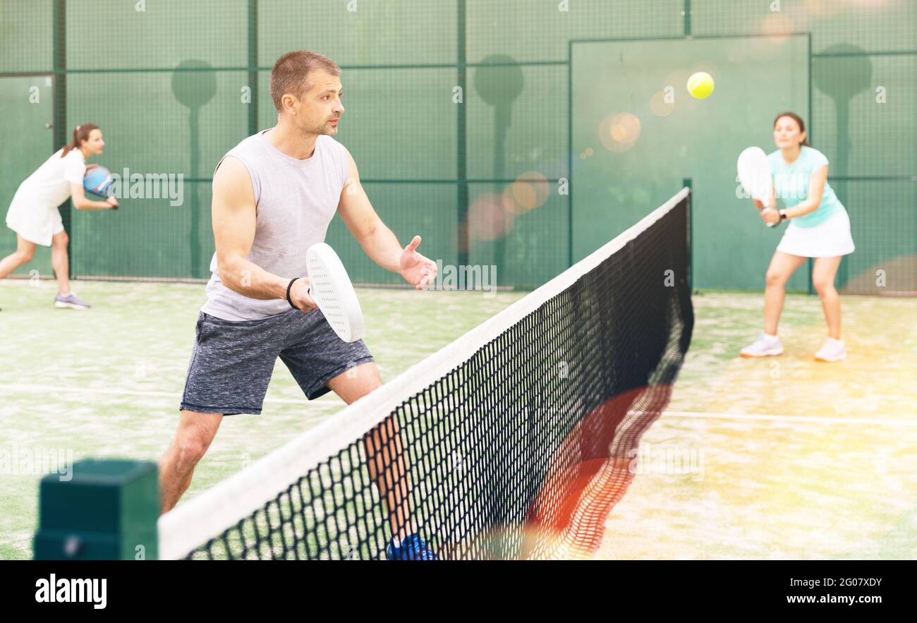 Young man playing padel tennis hi-res stock photography and images - Alamy