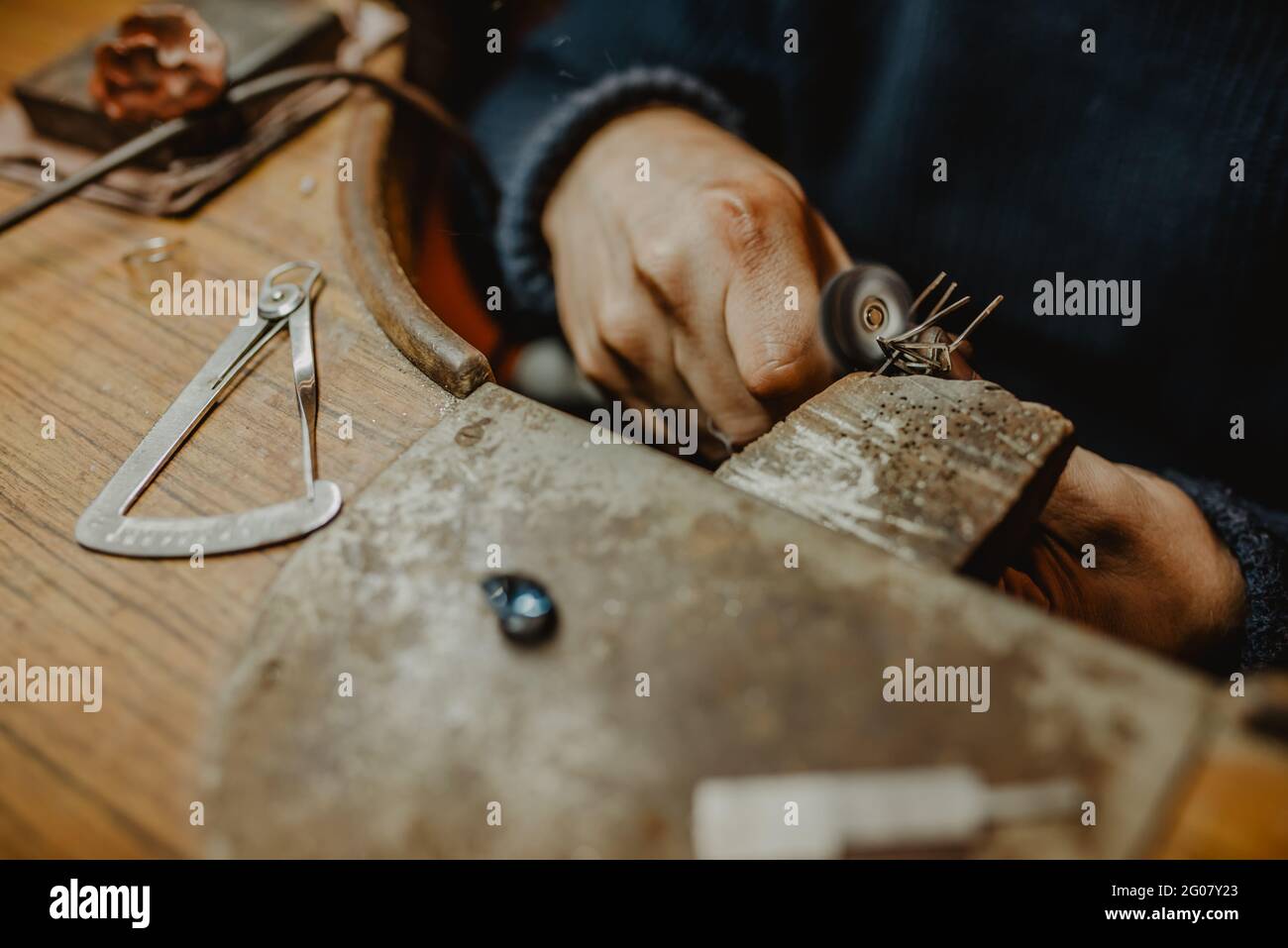 Jeweler using polishing machine hi-res stock photography and images - Alamy