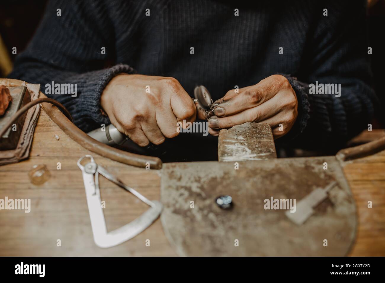 Jeweler using polishing machine hi-res stock photography and images - Alamy