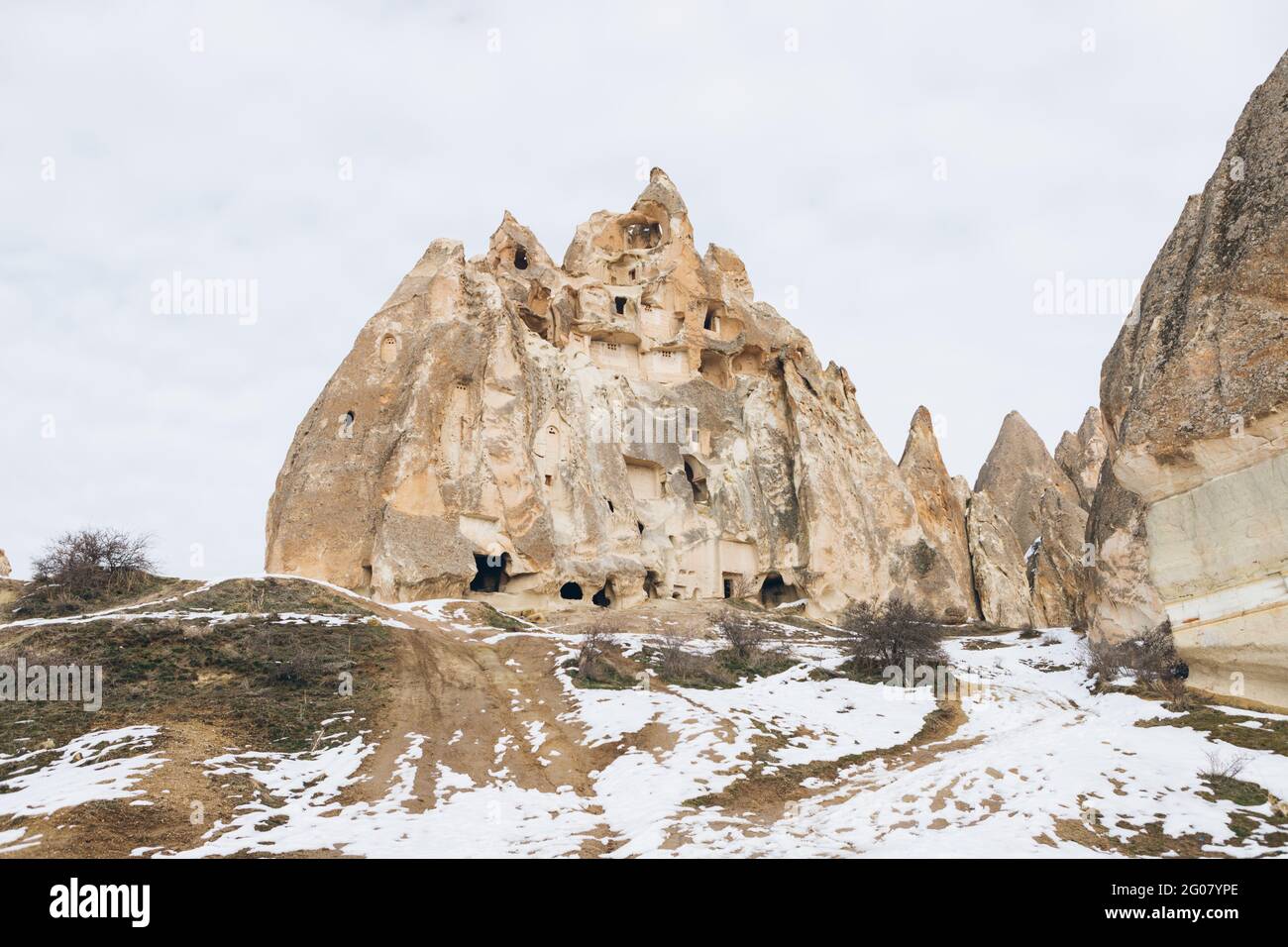 From above dirt road against snowy hill with famous pillars with sharp ...