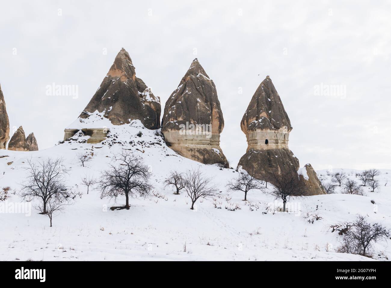 From above dirt road against snowy hill with famous pillars with sharp ...