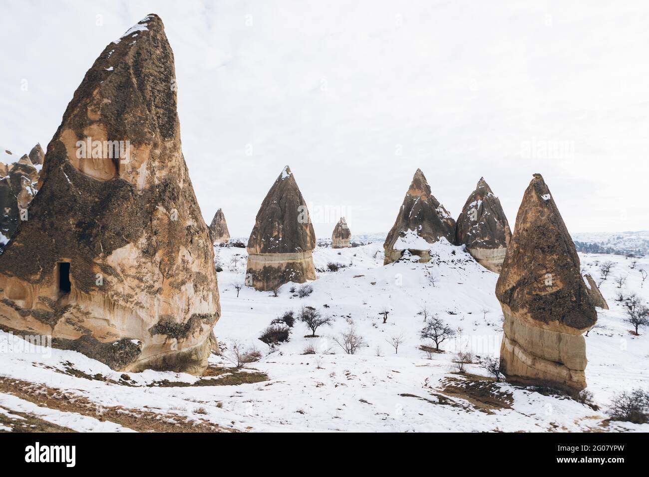 From above dirt road against snowy hill with famous pillars with sharp ...
