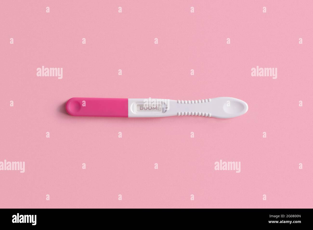 Top view of pregnancy test placed on pink background Stock Photo - Alamy