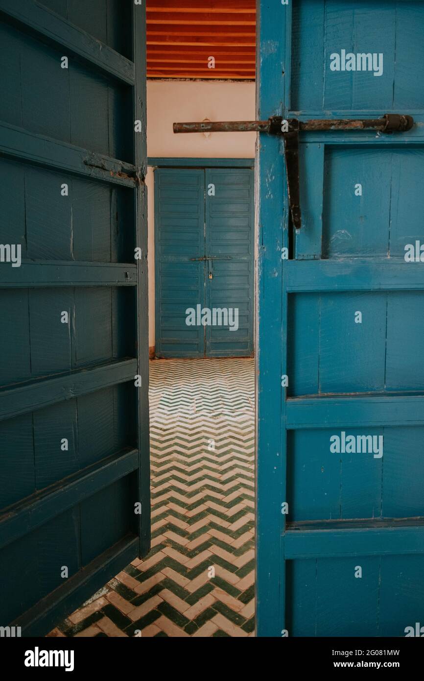 Open blue wooden gates in Marrakesh Stock Photo - Alamy