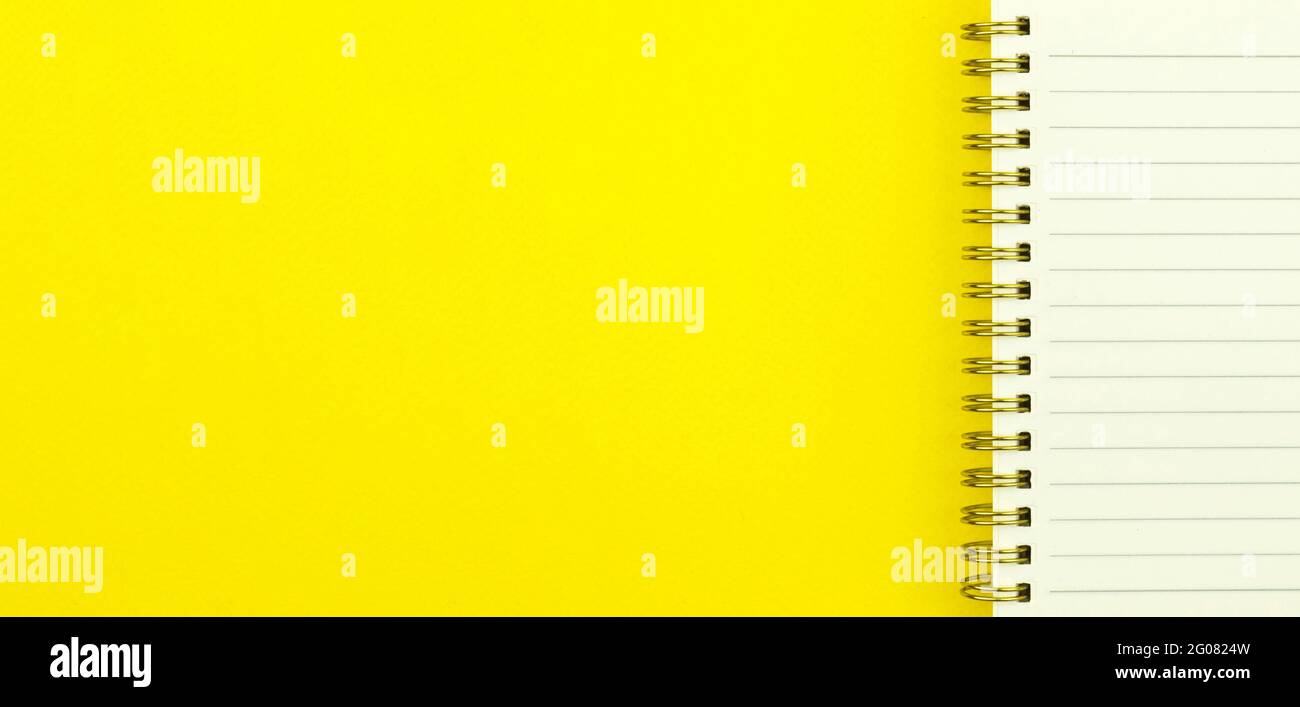 Creative banner with notepad close-up and flat lay yellow background ...