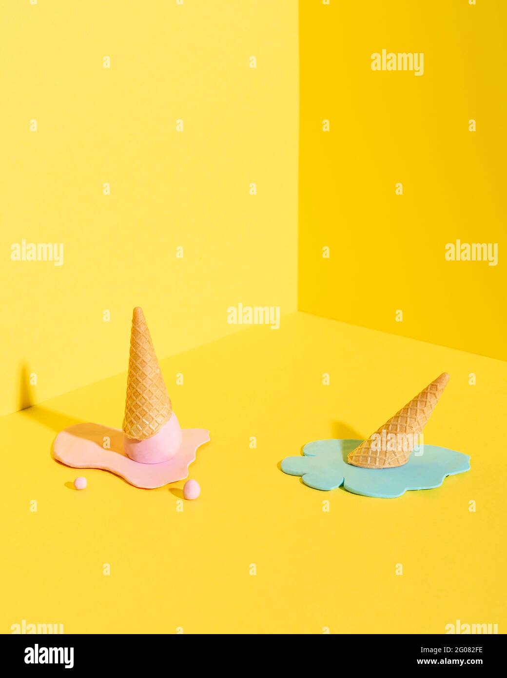 Mockup blue, yellow and pink melting ice cream in waffle cone placed on ...