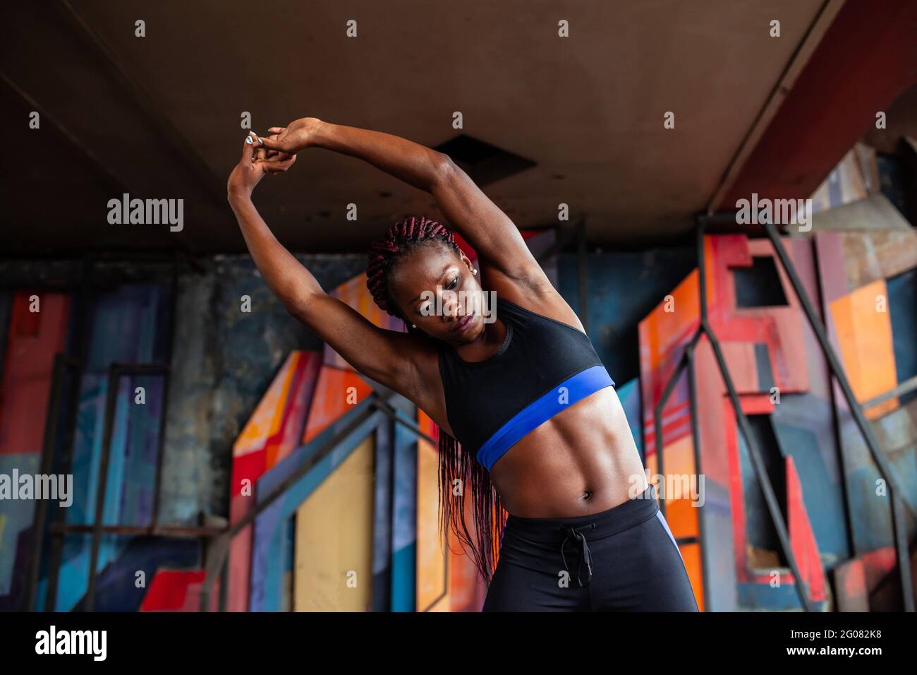 Ethnic Woman stretching arms Stock Photo - Alamy
