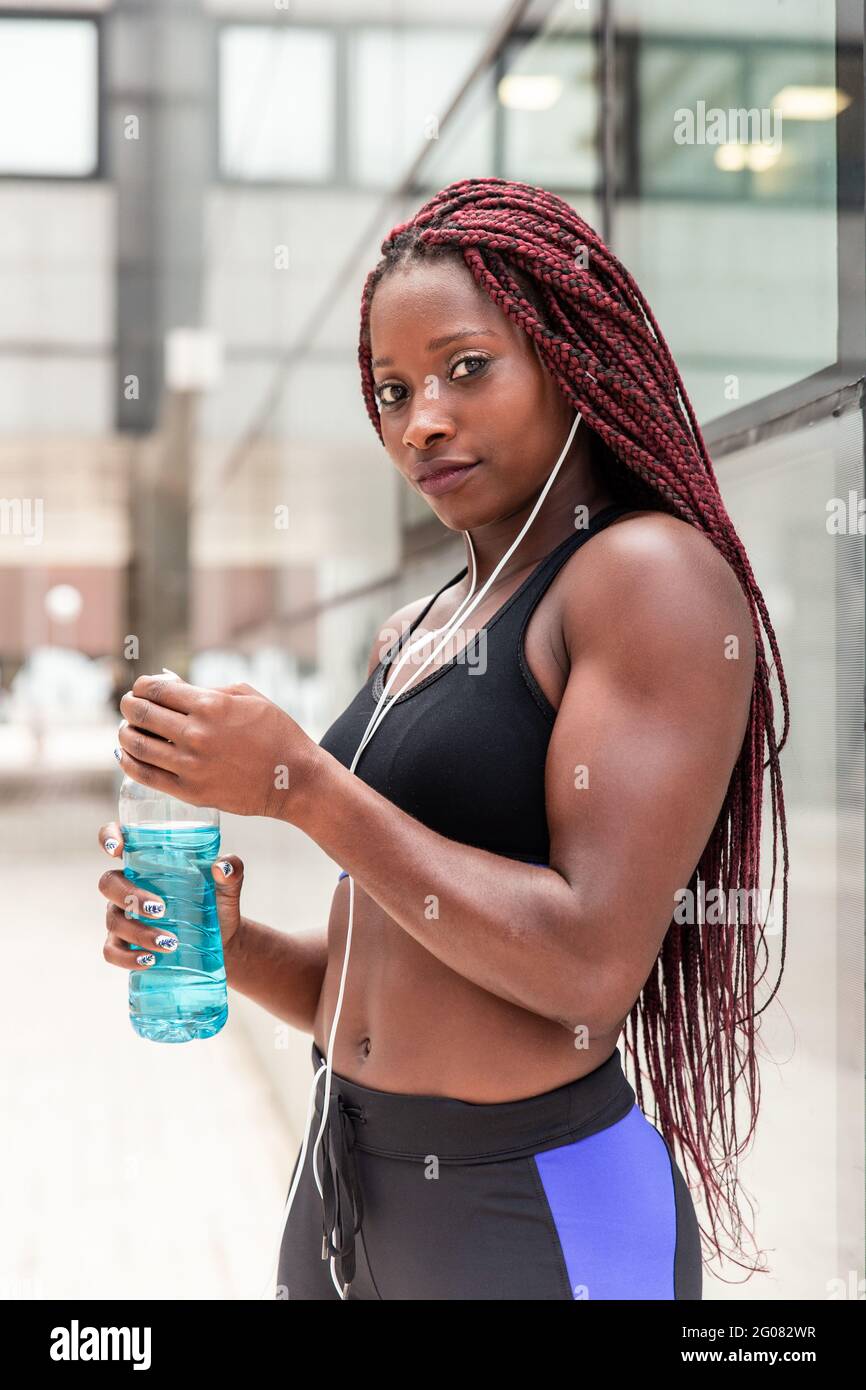 Muscular woman listening music hi-res stock photography and images - Alamy