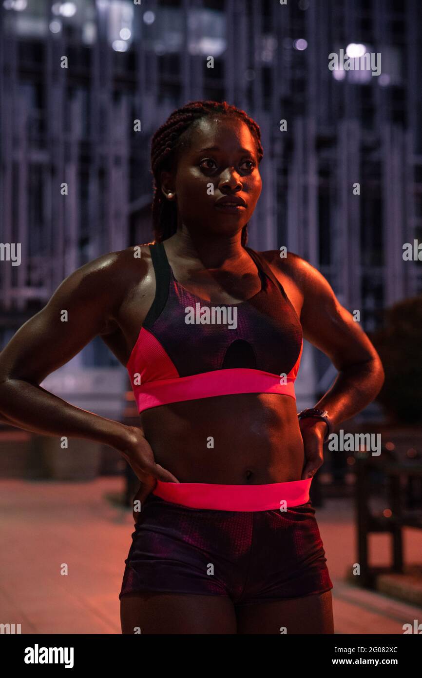 Muscular Woman in sportswear on street Stock Photo - Alamy