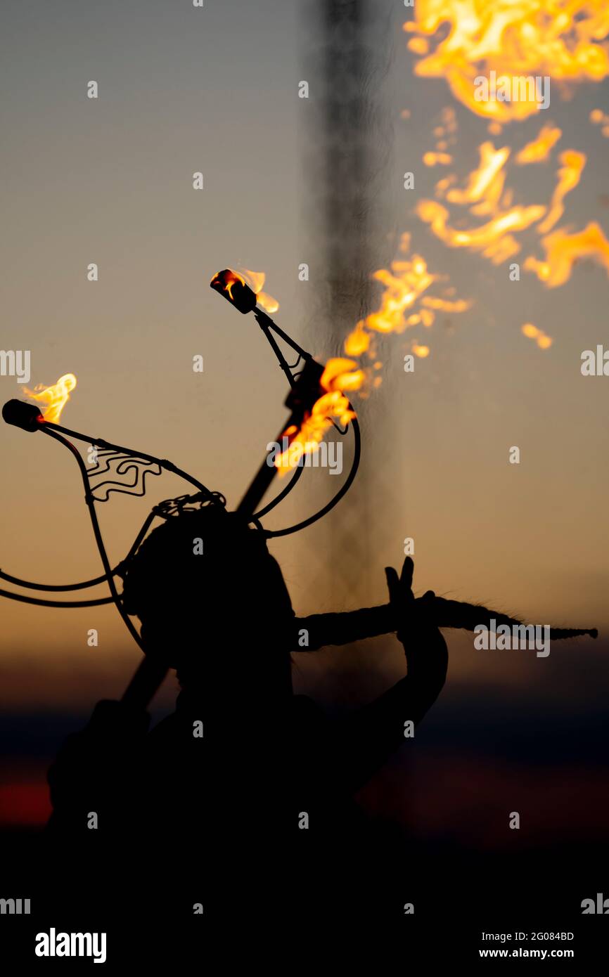 Fire-Eater Woman Performing Spit Fire At Sunset Stock Photo - Alamy