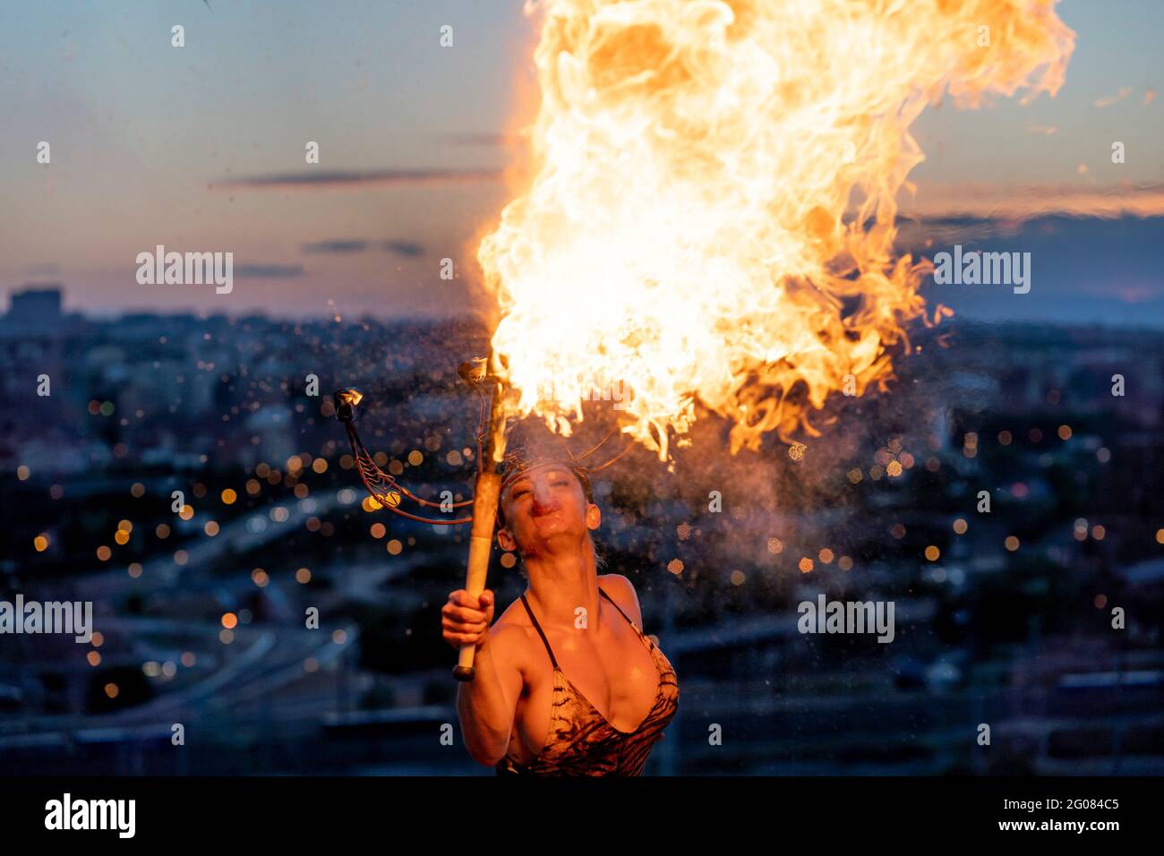 Fire-Eater Woman Performing Spit Fire At Sunset Stock Photo - Alamy