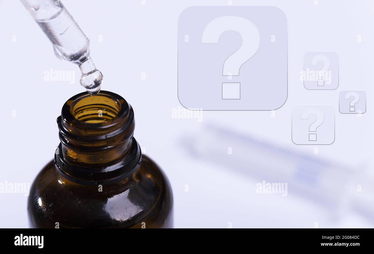 Closeup shot of a brown glass bottle with oil and a pipette with ...