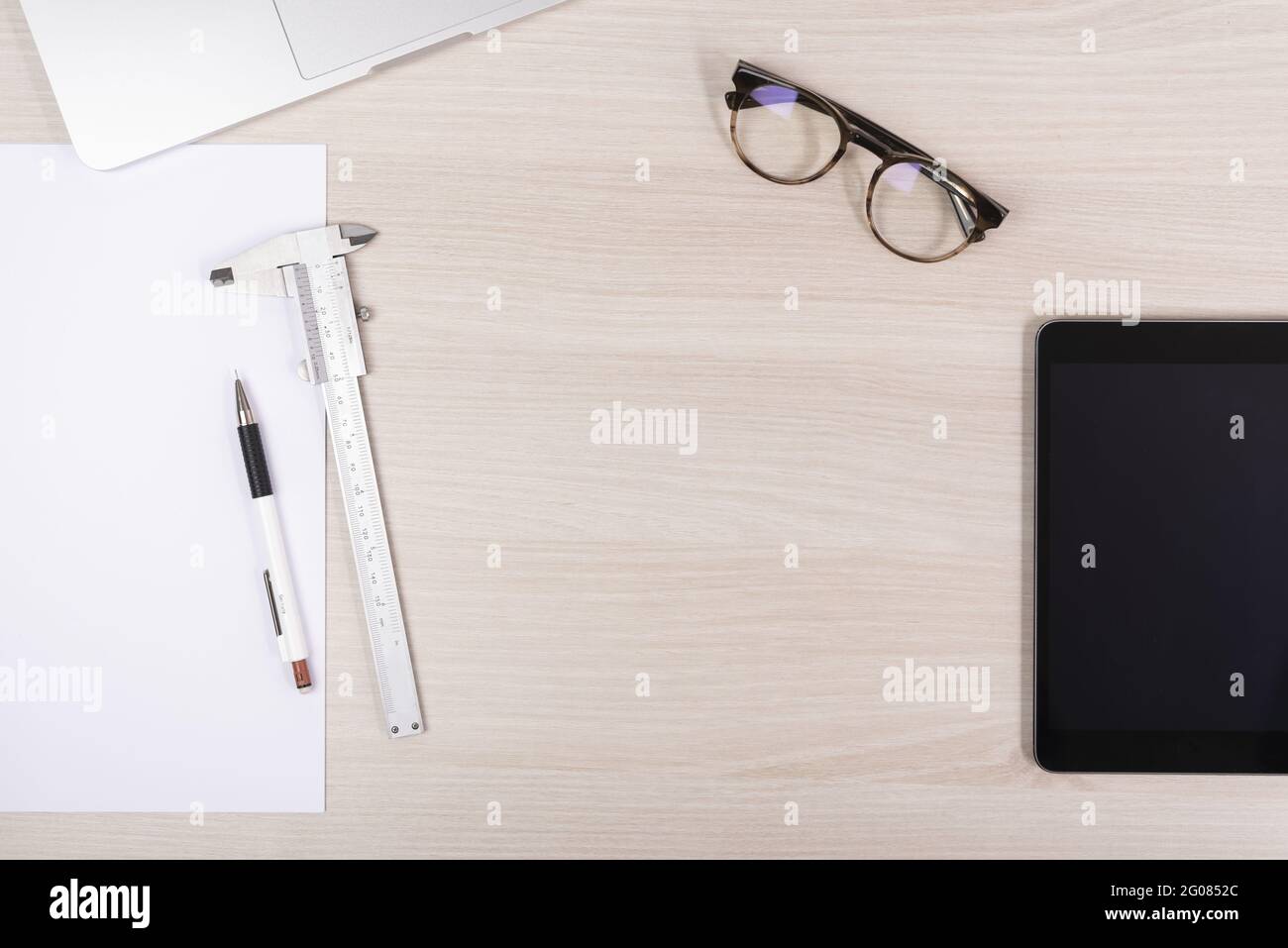 Top view of businessman workplace with papers, pen, vernier caliper ...
