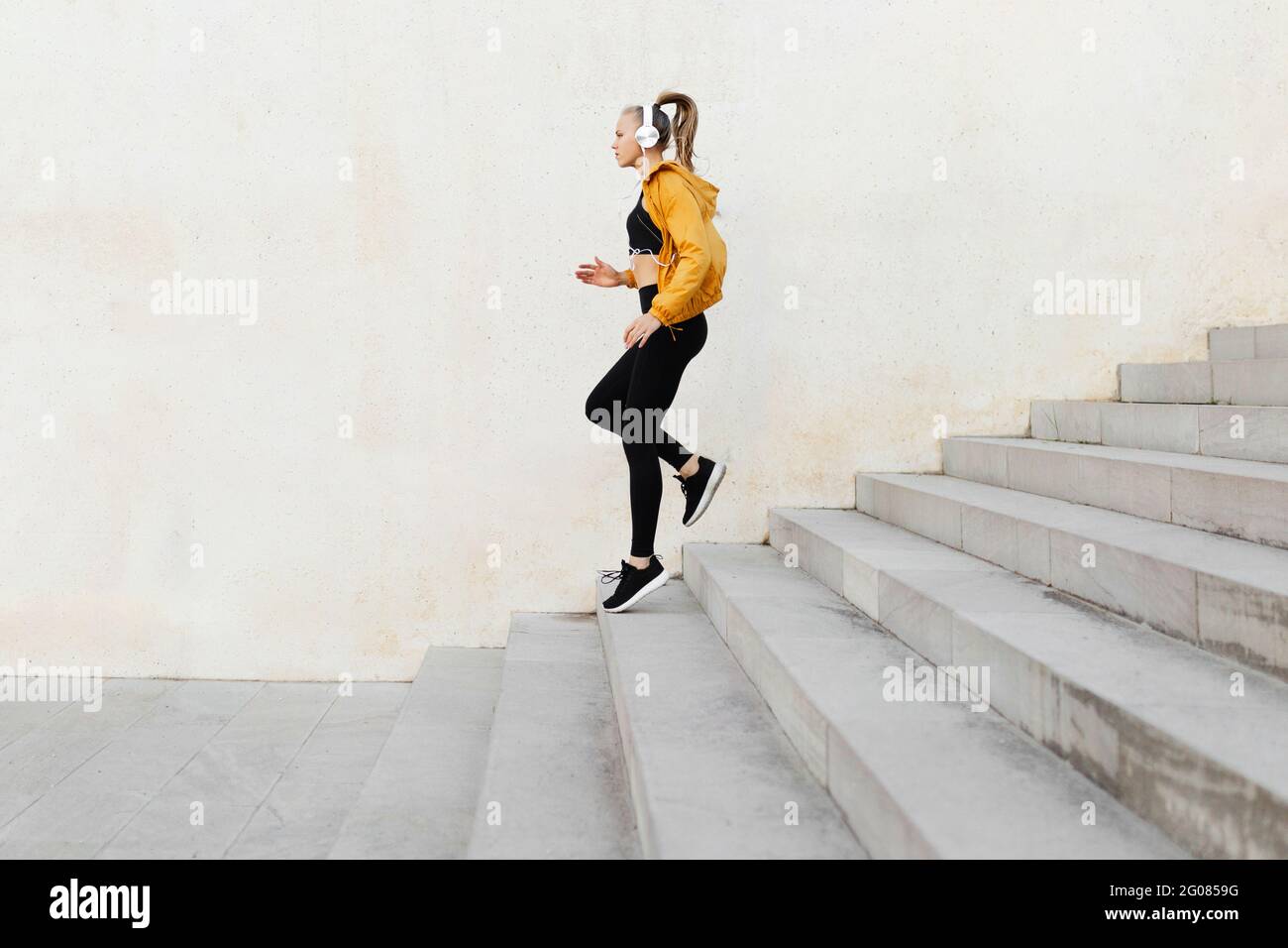 Woman running down stairs hi-res stock photography and images - Alamy