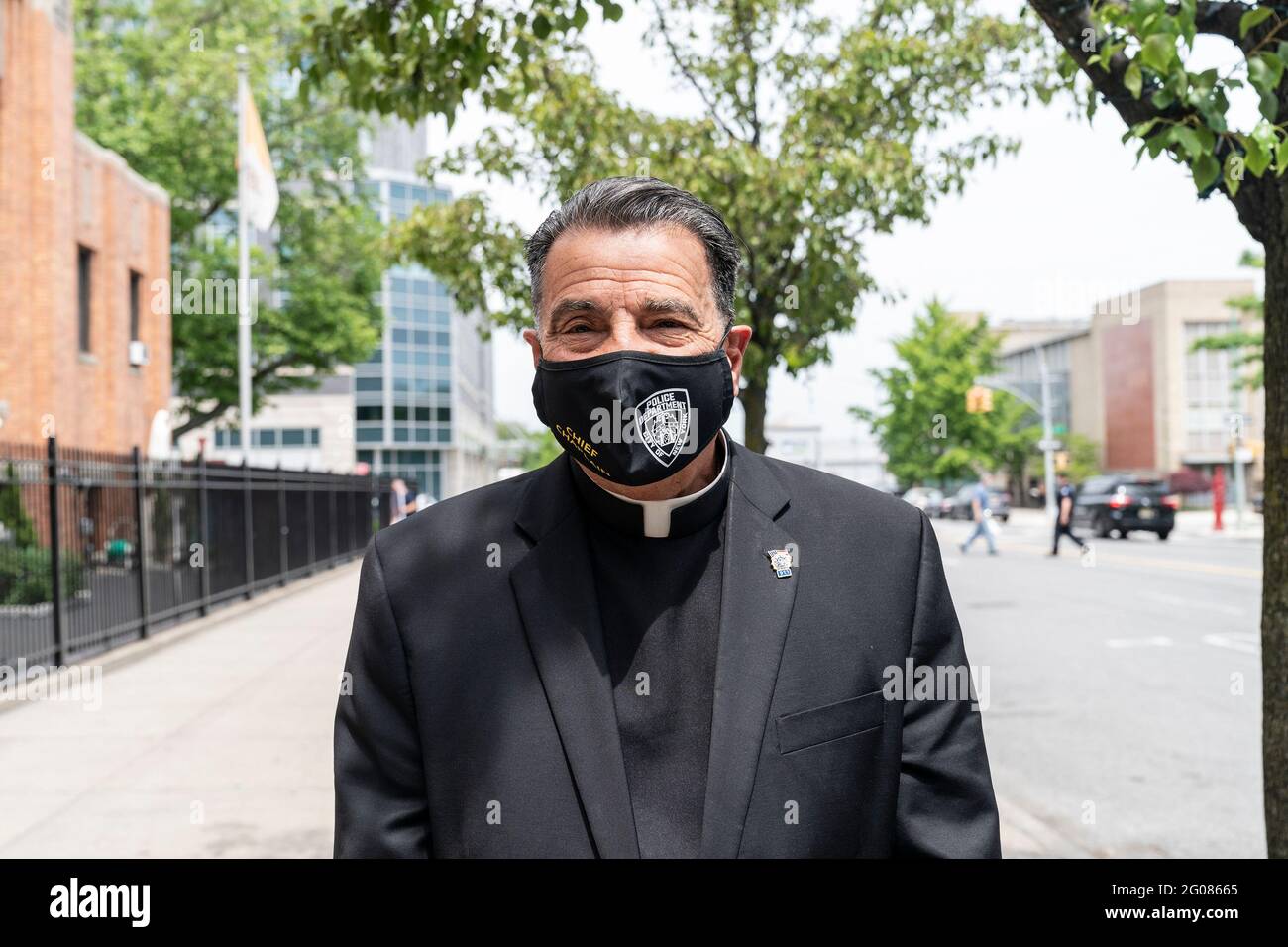 Monsignor David Cassato seen outside of Saint Athanasius Catholic ...