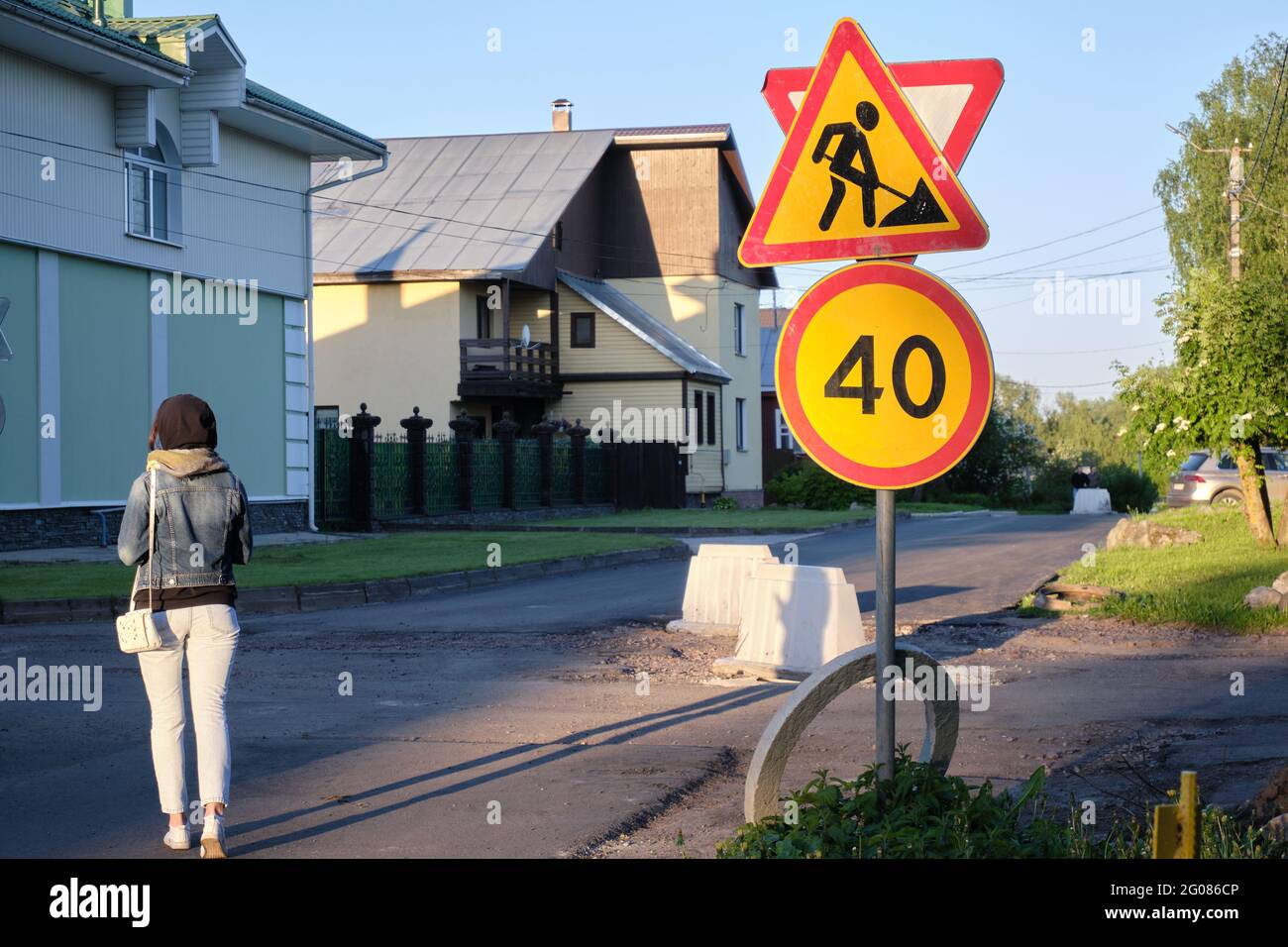 Road works. Warning signs. Replacement of the road surface. City ...