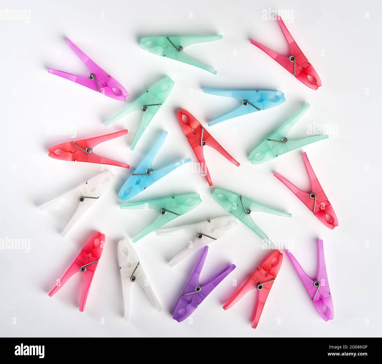 Colorful clothes pegs isolated on white background Stock Photo - Alamy