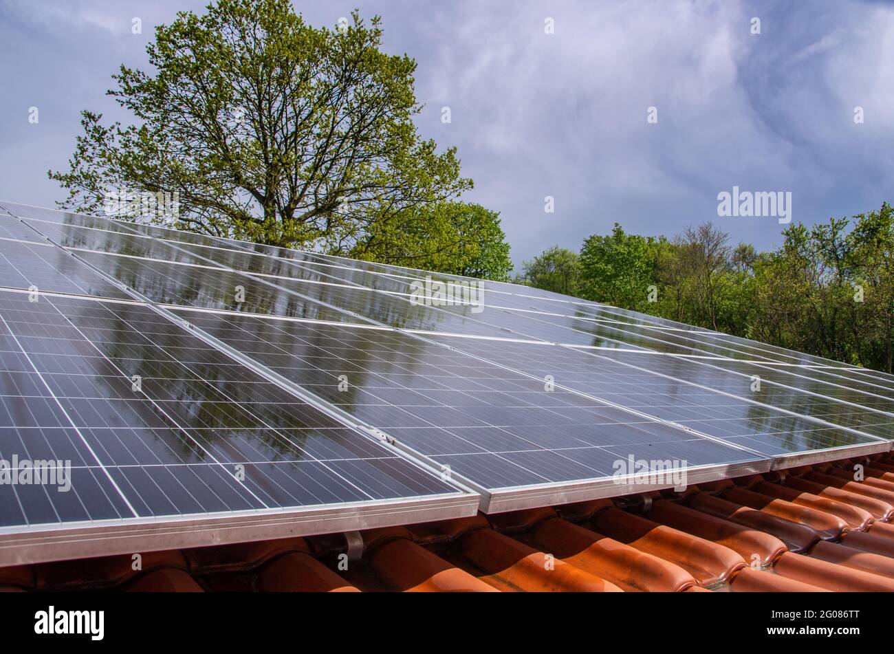 Sunlit wet photovoltaic system after rain Stock Photo - Alamy