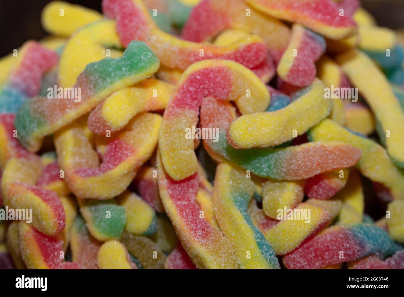 Multicolored jelly worm candies textured background Stock Photo - Alamy