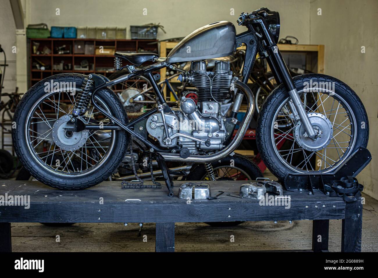 Motorcycle in Garage . Vintage style cafe-racer motorcycle Stock Photo ...