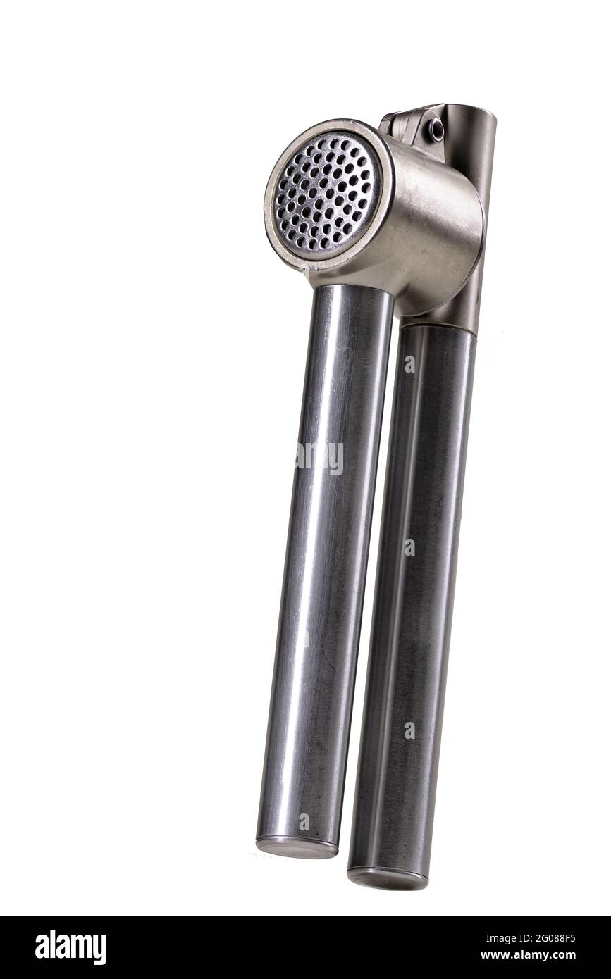 Metal squeezer for garlic and other small vegetables used in home ...
