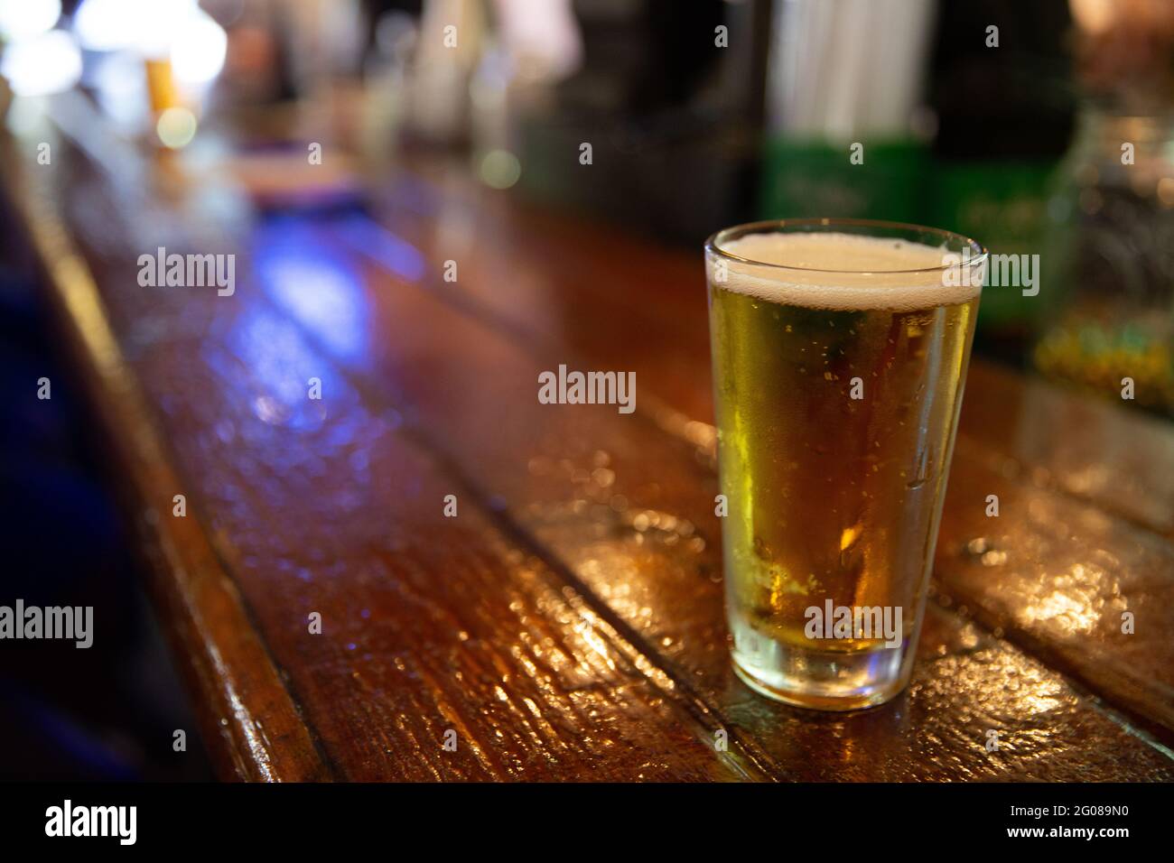 Single cold beer on the bar Stock Photo - Alamy