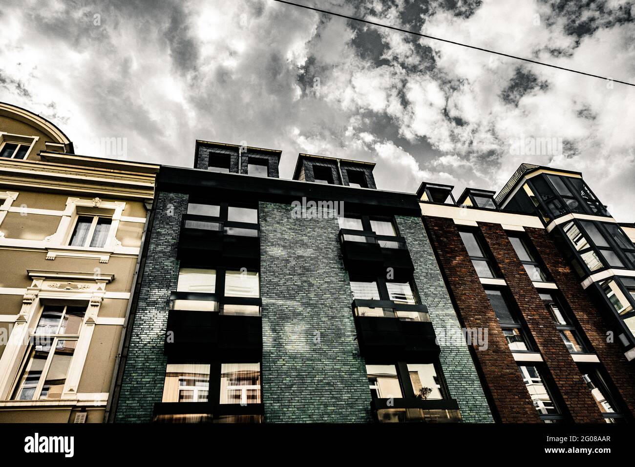 Low angle shot of modern residential buildings with balconies under a ...