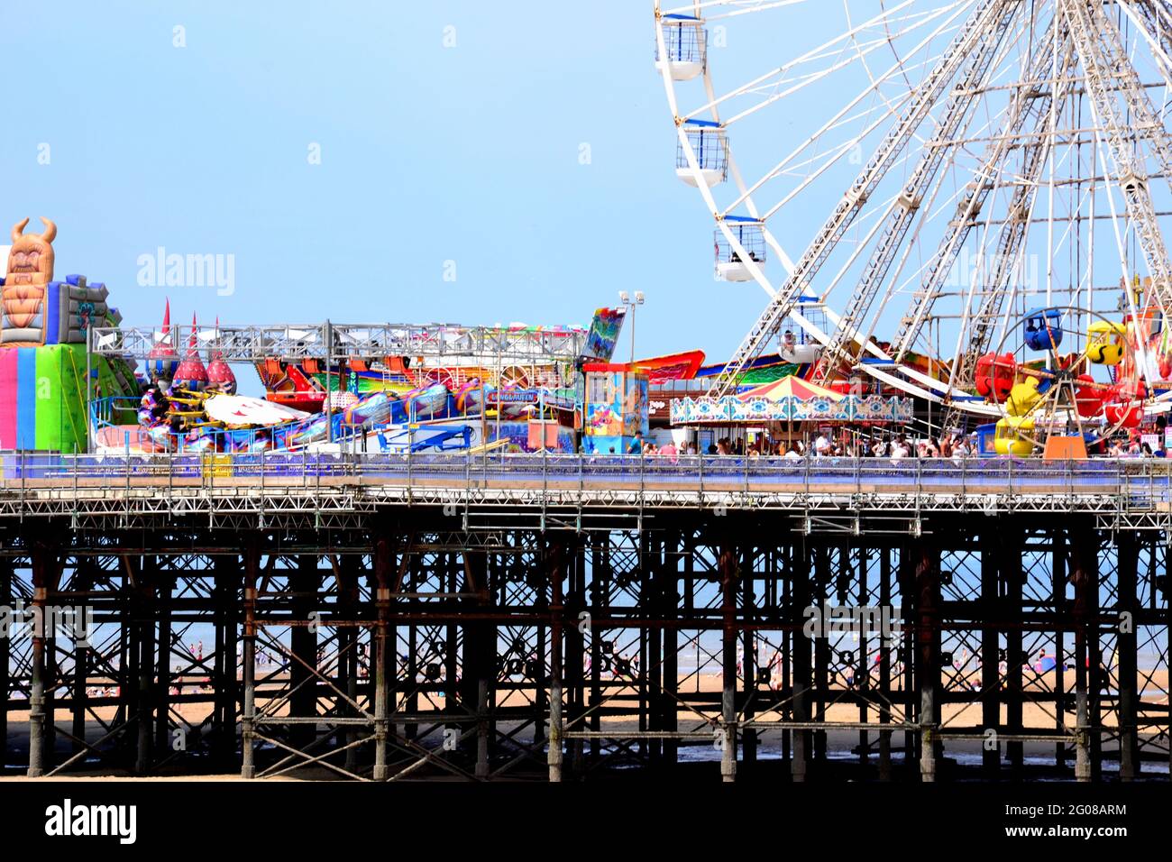 Fairground rides, amusements and a big wheel on the Central Pier in ...