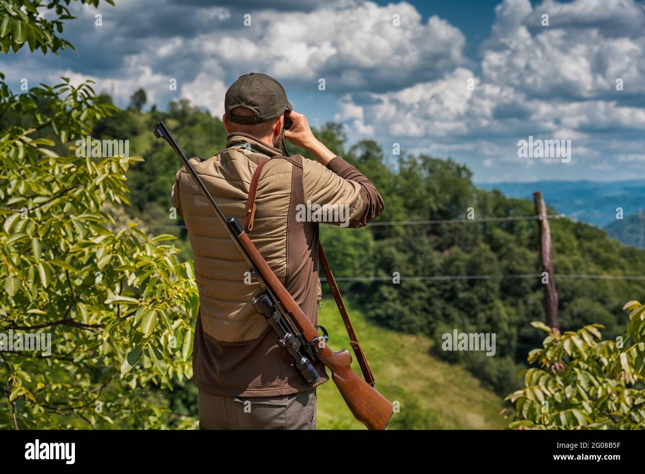 Young hunter checking his surrounding for prey Stock Photo - Alamy