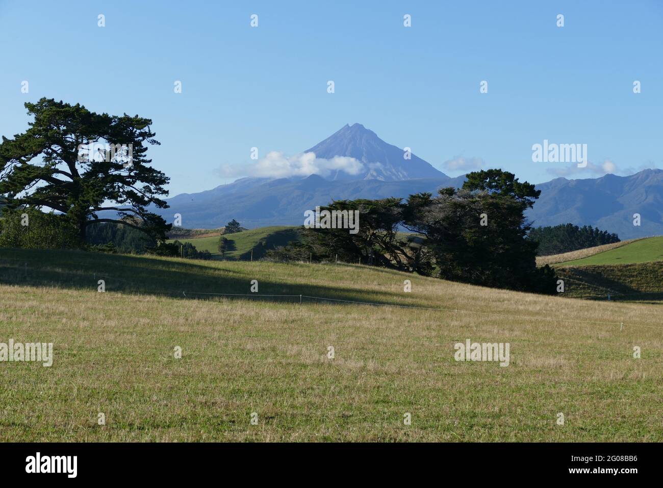 Clouds resting on the side of a volcano Stock Photo - Alamy