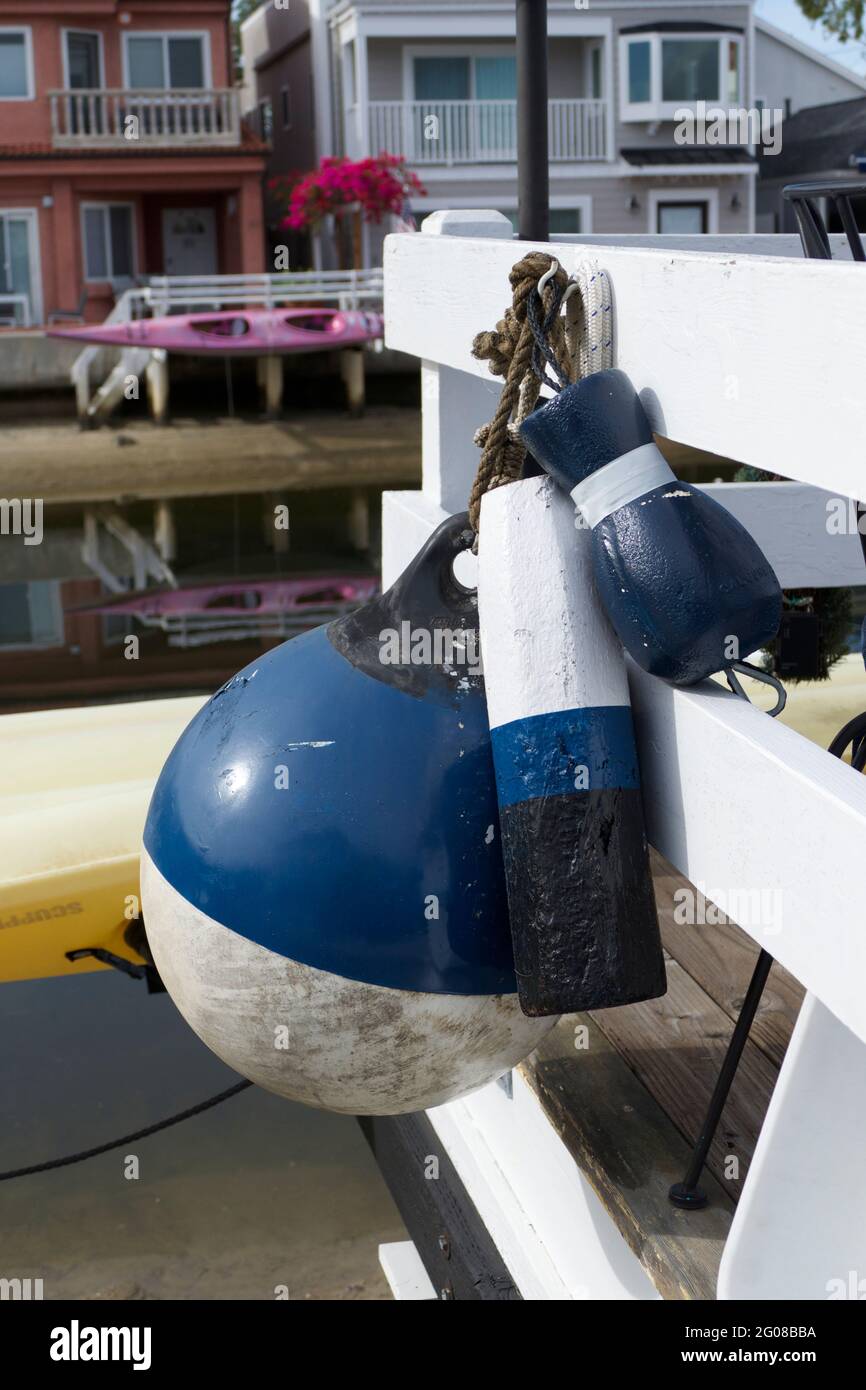 collection of marine buoys and markers hanging from the railing Stock ...