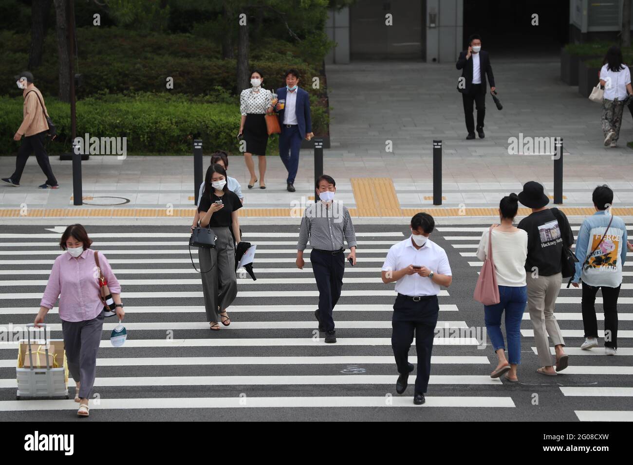 Seoul, South Korea. 1st June, 2021. People wearing masks walk on a ...