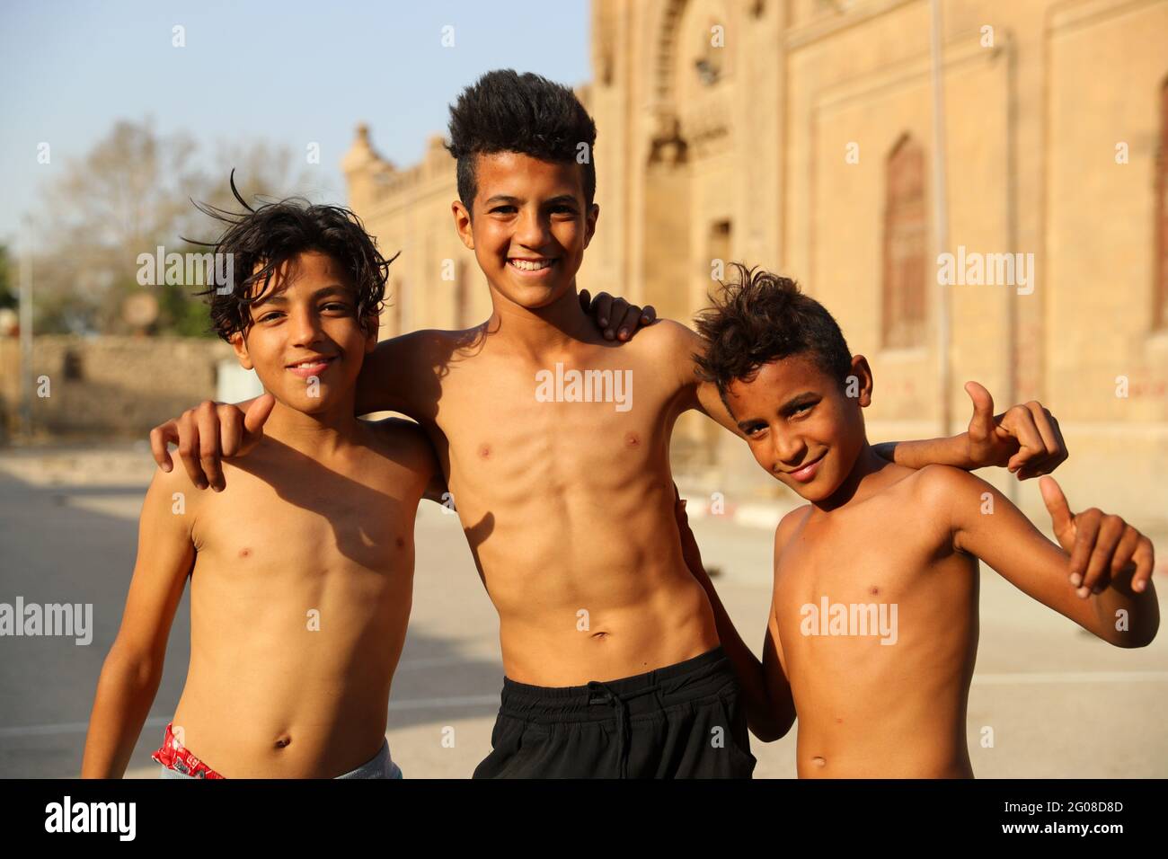 Cairo, Egypt. 1st June, 2021. Children pose for a photo while playing ...