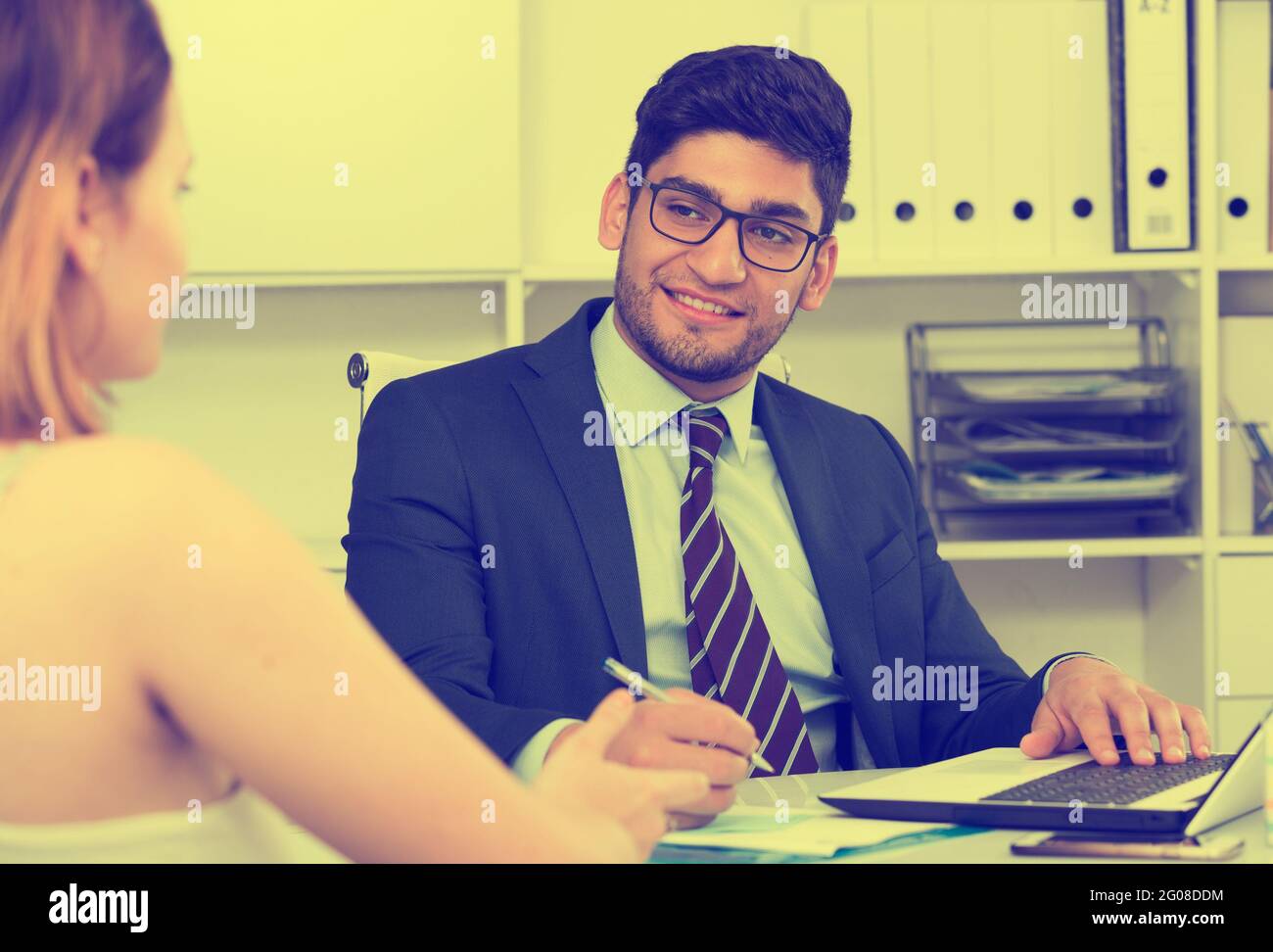 Businessman with female client Stock Photo - Alamy