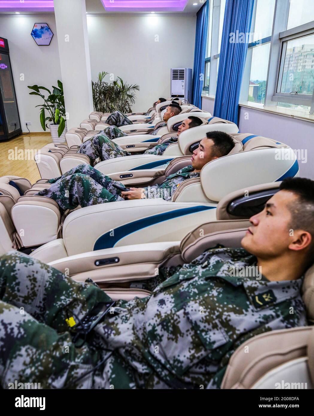 ZHENJIANG, CHINA - JUNE 1, 2021 - Soldiers take a massage chair to ...