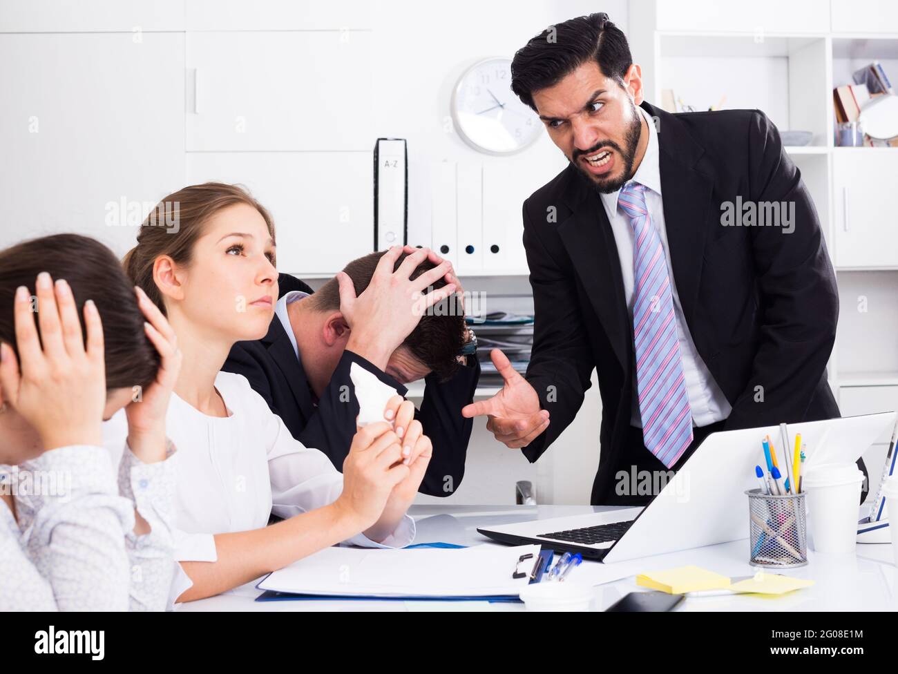 Irritated boss scolding subordinates Stock Photo - Alamy