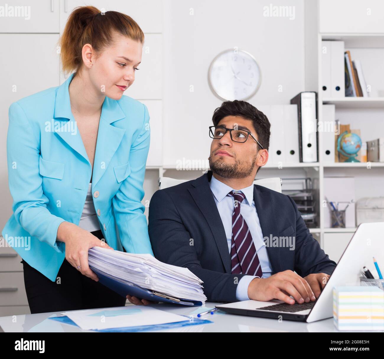 Overworked man pile of papers hi-res stock photography and images - Alamy