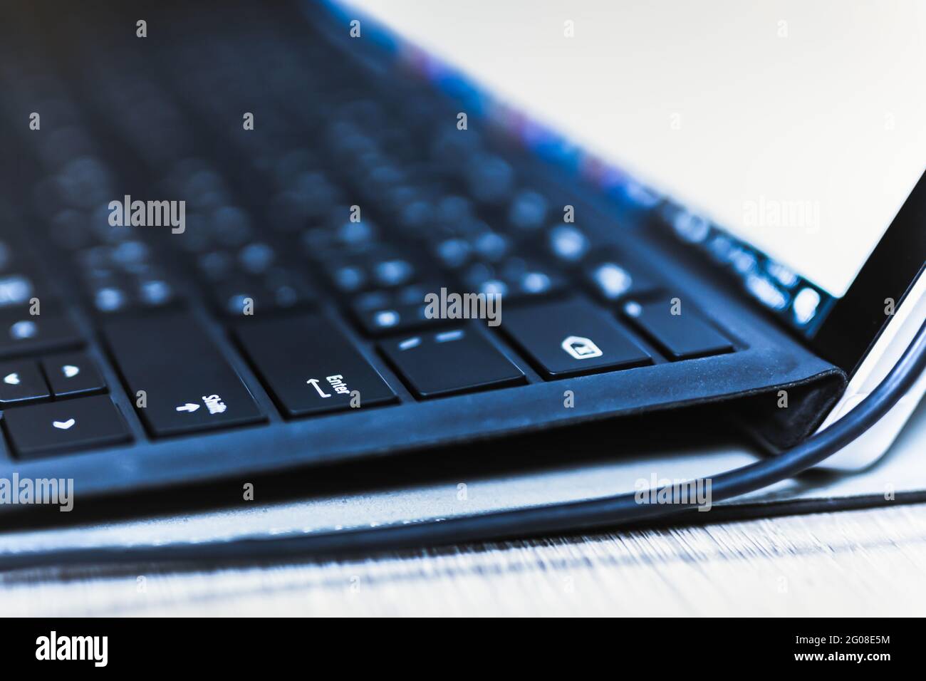 Close up tablet keyboard computer focus at enter button Stock Photo - Alamy