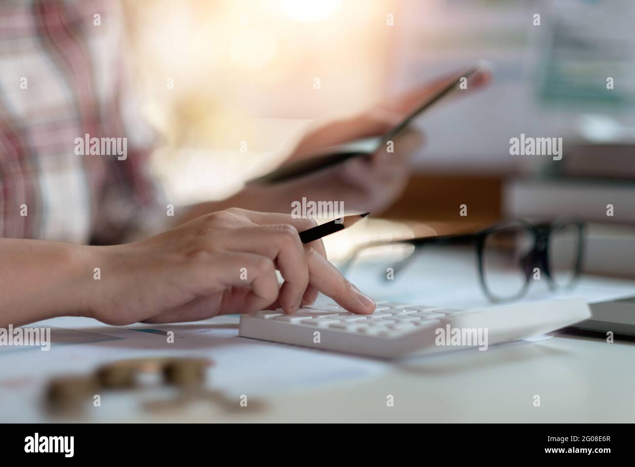Close up woman calculating monthly home expenses, taxes, bank account ...