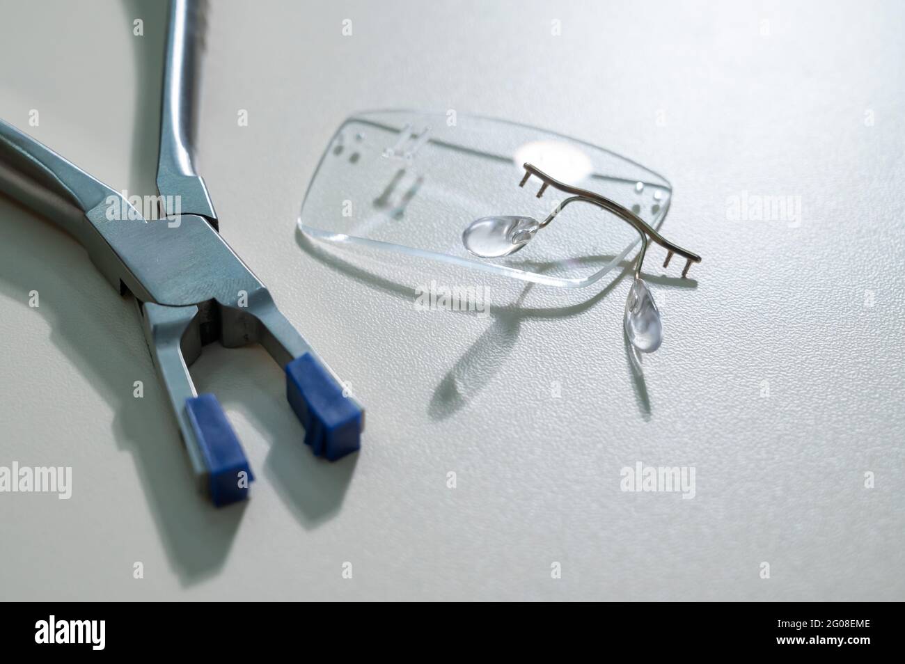 Disassembled glasses and instruments by an ophthalmologist Stock Photo ...