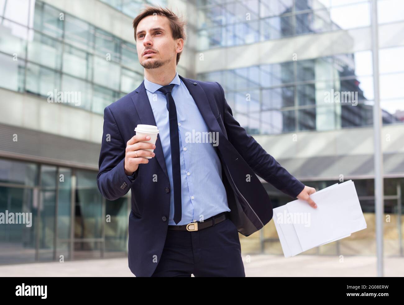 man with documents hurrying to meeting Stock Photo - Alamy
