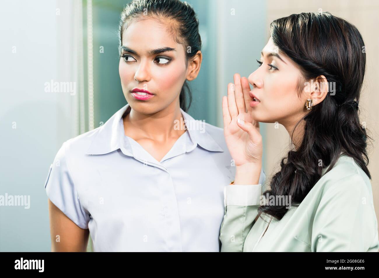 Whispering in ear hi-res stock photography and images - Alamy