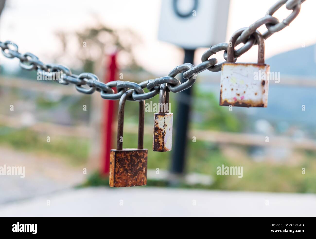 Chain with three padlocks hi-res stock photography and images - Alamy