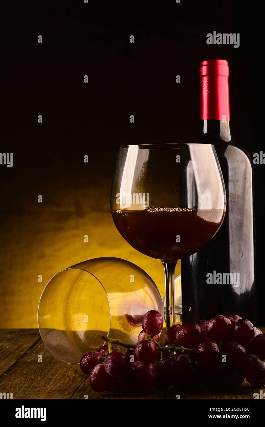 Glass and bottle of wine on the table Stock Photo - Alamy