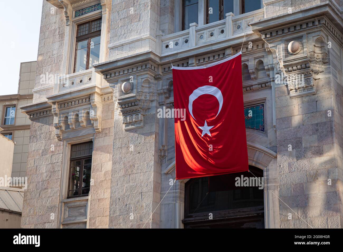 Waving national Turkish Flag on ancient stone wall Stock Photo - Alamy